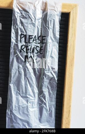 please reuse me plastic bag Stock Photo - Alamy