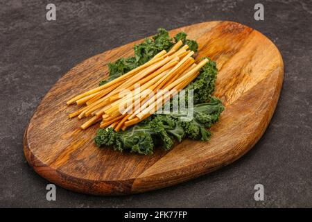 Caucasian Chechel cheese sticks over board Stock Photo - Alamy