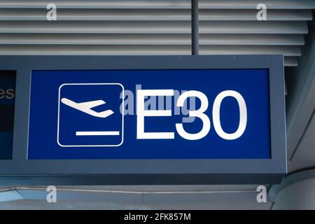 Boarding gate number sign at the airport Stock Photo - Alamy