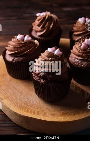 Delicious dark chocolate buttercup cupcakes, sugar heart topping ...
