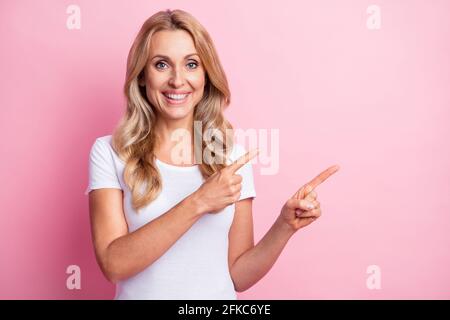 Photo of pretty adorable wavy lady wear blue sweatshirt pointing empty ...