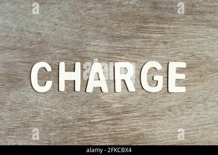 Alphabet letter in word charge on artificial green grass background ...