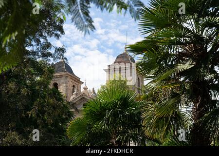 Church seen trough some big trees from old Turia riverbed. Valencia ...