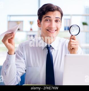 The businessman with magnifying glass and paper plane Stock Photo - Alamy