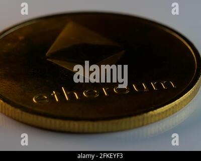 Closeup of golden Bitcoin and Ethereum cryptocurrency coins with chain ...