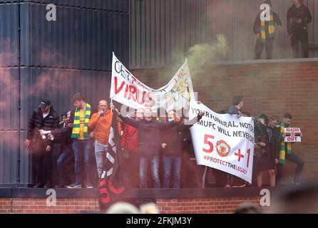 Fans holds up banners as they protest against the Glazer family, owners ...