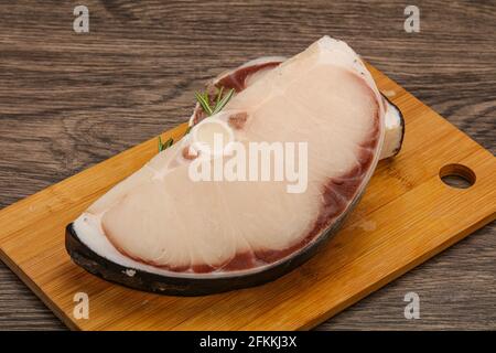 Raw shark steak served rosemary for cooking Stock Photo - Alamy