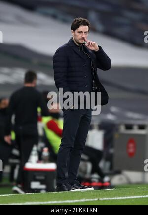 Tottenham Hotspur interim manager Ryan Mason (left) and Wolverhampton ...