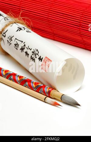 Brush and Chinese calligraphy, characters, ink brush Stock Photo - Alamy