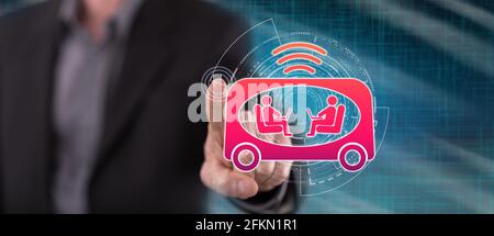 Man touching a self-driving car concept on a touch screen with his ...