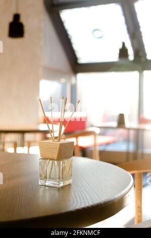 Aroma oil diffuser with aroma oil on table at home. Air freshener Stock ...