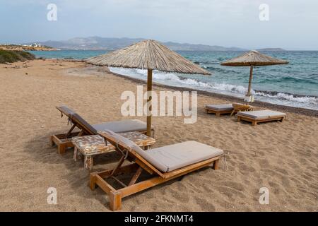 View of sandy Soros Beach on the Greek island of Antiparos with sunbeds ...