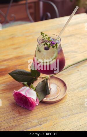 Fresh icy sparkling drink with flowers limes and berries Stock Photo ...