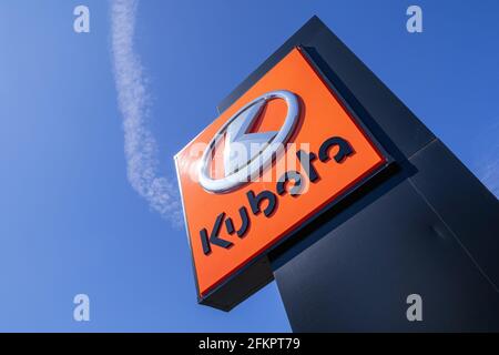 Kubota dealership sign against blue sky Stock Photo - Alamy
