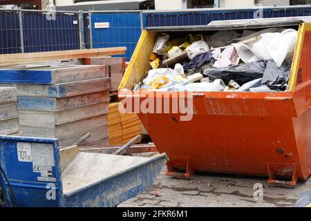 Construction debris container on a street in the city of Madrid Stock ...