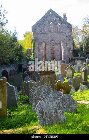 A backlit view of the ruins of the historic Greyabbey Monastery that ...