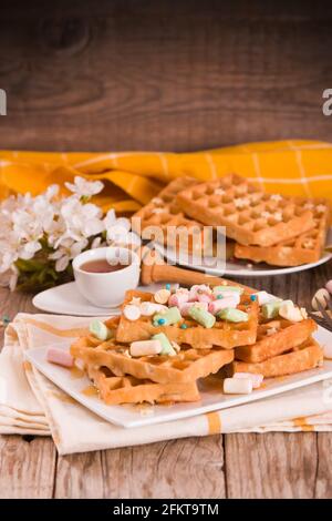 Waffles with colourful marshmallow Stock Photo - Alamy