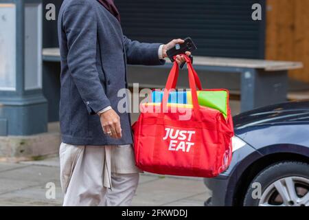 Just Eat orange lunches on order on a wet cold, chilly day in Preston ...