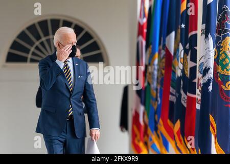 President Joe Biden salutes as he walks to board Marine One at Fort ...