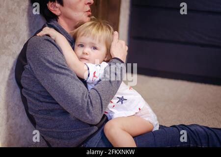 Happy mother and daughter snuggled up together Stock Photo - Alamy