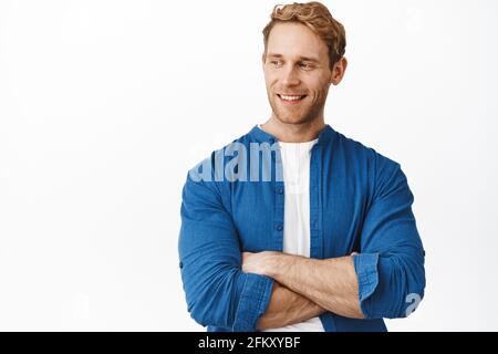 Close-up of confident and sassy redhead teen girl looking at camera ...