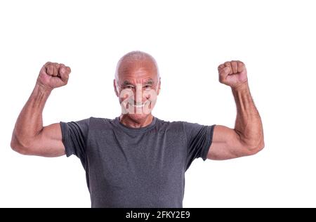 An elderly man, an athlete in excellent physical shape, celebrates a ...