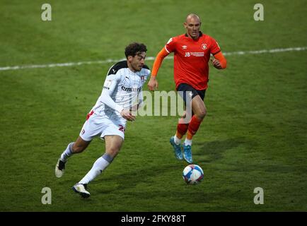 Luton Town's Kal Naismith (right) is shown a red card by referee ...