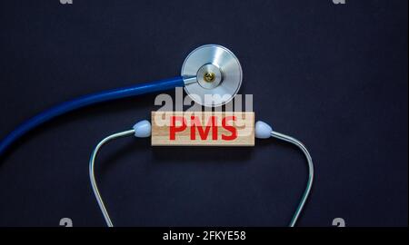 Medical and PMS, premenstrual syndrome symbol. Wooden cubes and blocks ...