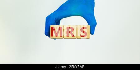 Medical and MRS, menstrual related symptoms symbol. Wooden blocks with ...