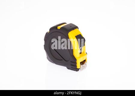 Yellow flexometer with black on white background Stock Photo - Alamy