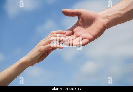Solidarity, compassion, and charity, rescue. Hands of man and woman ...