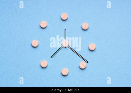 The array of medicine tablet formed the clock Stock Photo - Alamy