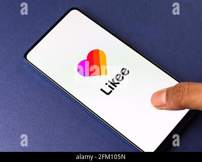 Smartphone with Likee short video sharing service logo on screen in ...