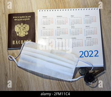 December 2022 - spiral desktop calendar against magenta paper, low ...