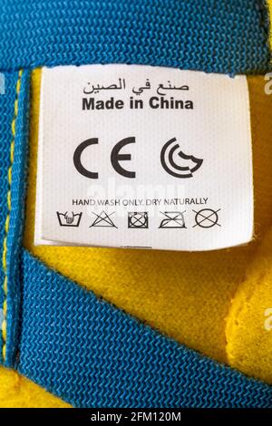 CE mark symbol and washing cleaning instructions on label of blue ...
