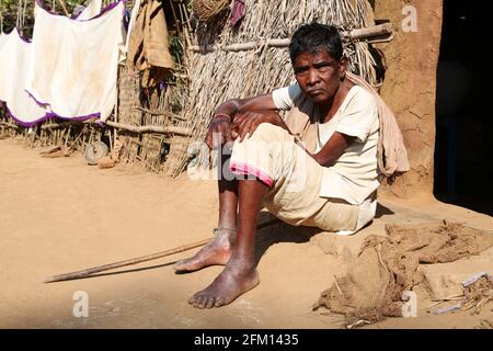 Old rural indian village man metalworking at a small outside furnace ...