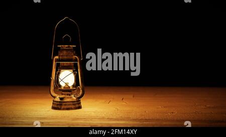 old gas lantern on wooden table with empty space Stock Photo - Alamy