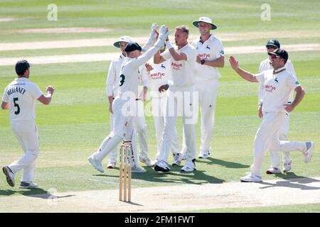 Stuart Broad of Notts celebrates with his team mates after taking the ...