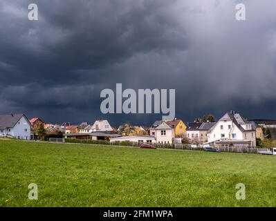 storm clouds thunderclouds over the village in spring Stock Photo - Alamy
