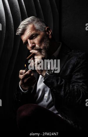 Man lighting cigar, portrait Stock Photo - Alamy