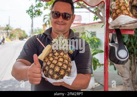 Pina Colada street vendor and tourists, Varadero, Cuba, year 2017 Stock ...