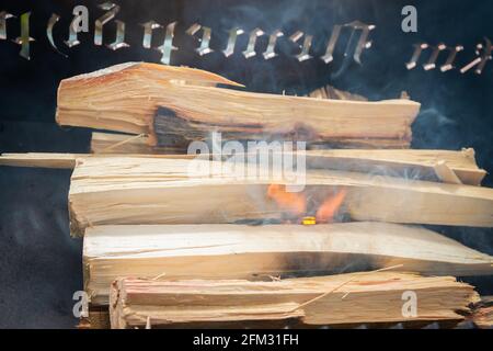 Dry wood in the grill for kindling and making coals Stock Photo - Alamy