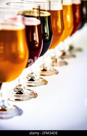 A row of assorted craft beers on a table Stock Photo - Alamy