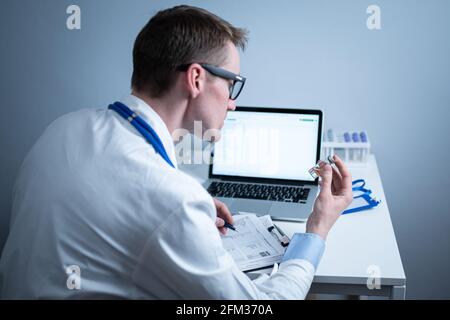 Scientist holding ampule with vaccine against monkeypox, closeup Stock ...