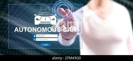 Woman touching an autonomous car concept on a touch screen with her ...