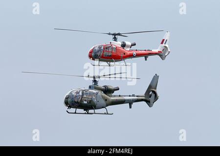 Formation flight of Royal Army Gazelle helicopters Stock Photo - Alamy