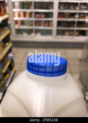 A carton of British full fat pasteurised milk with a blue bottle top ...