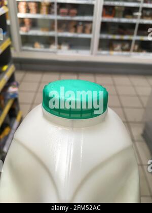 Small green top milk carton and milk Stock Photo - Alamy