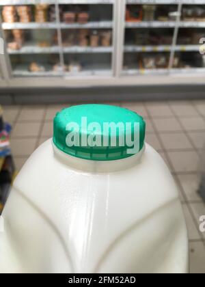 Small green top milk carton and milk Stock Photo - Alamy
