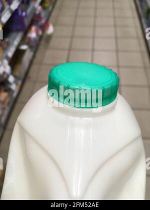 Small green top milk carton and milk Stock Photo - Alamy